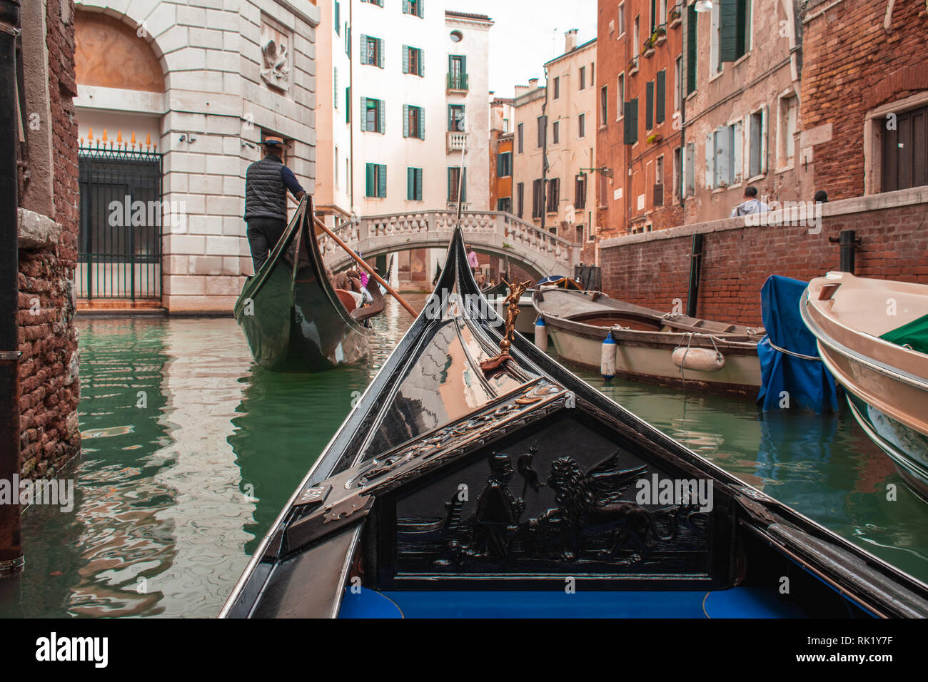 Riding a Gondola in Venice through its canals Stock Photo - Alamy