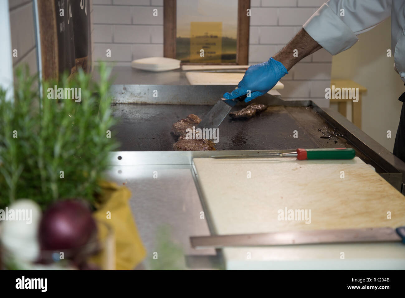 Chef Cooking the Burgers on the Hot Plate Stock Photo - Alamy