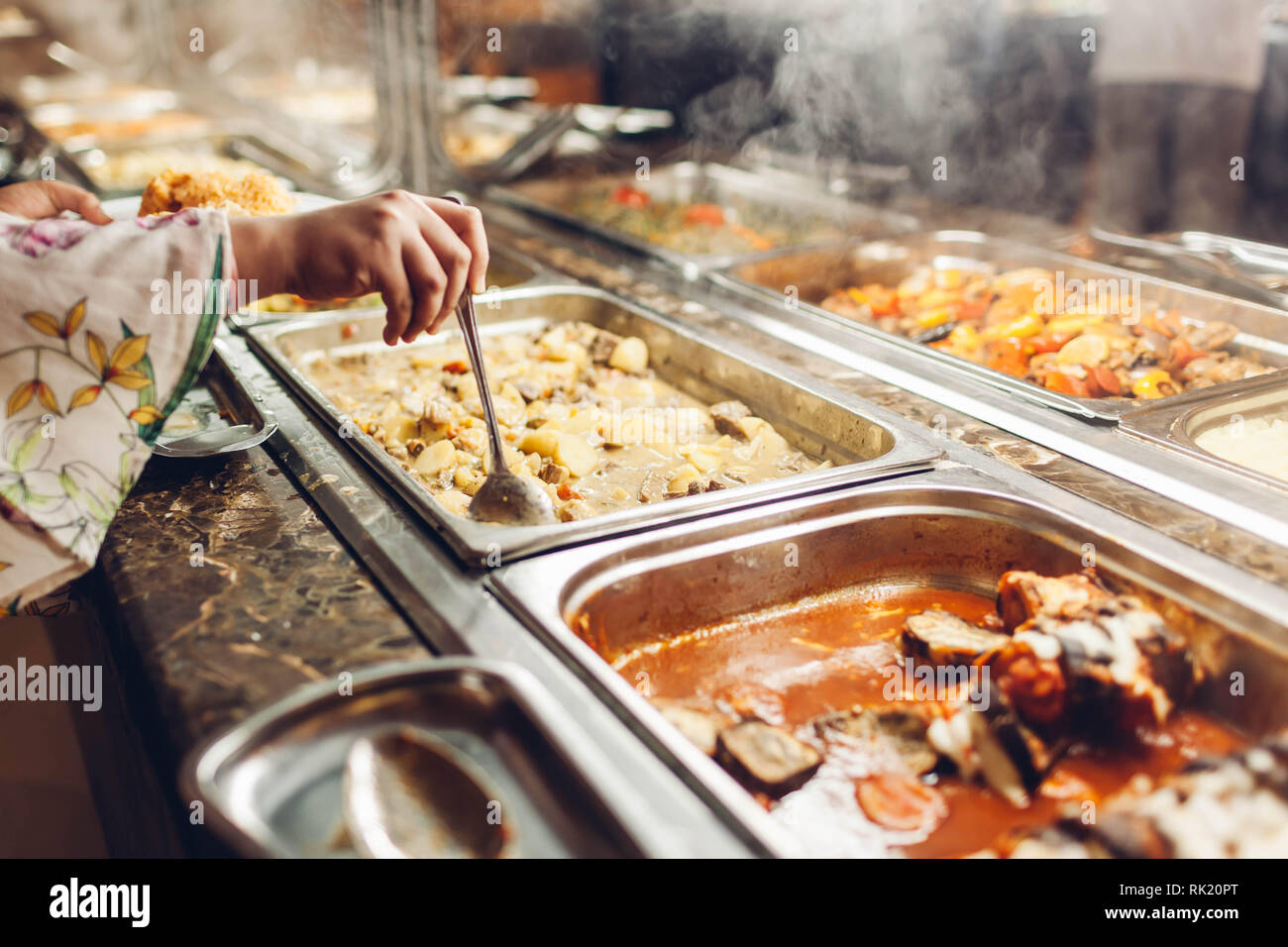 Assortment of fresh dishes displayed in hotel buffet. Variety of food ...