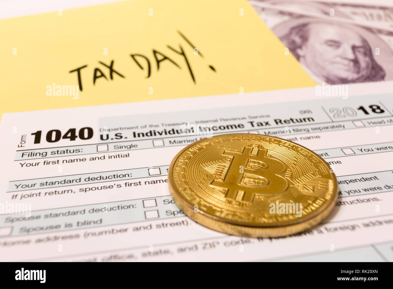 Bitcoin coin with 1040 income tax form for 2018 for filing on April 15 ...