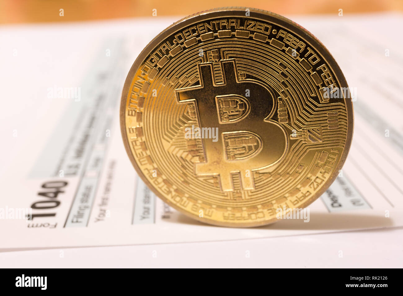 Bitcoin coin with 1040 income tax form for 2018 for filing on April 15 ...