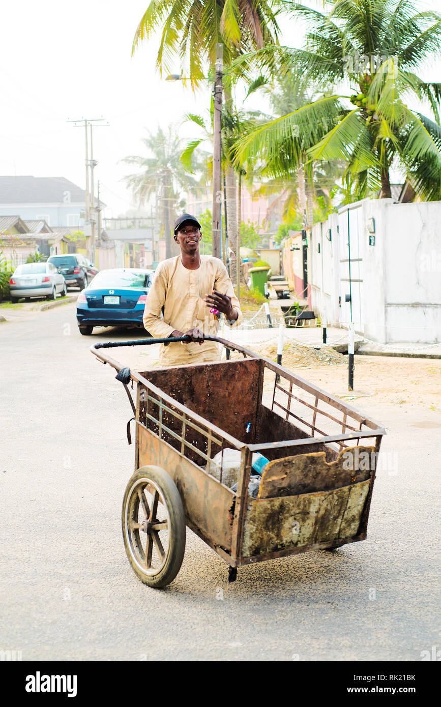 Urban jobs - A scavenger in the streets of Lagos with his cart Stock ...