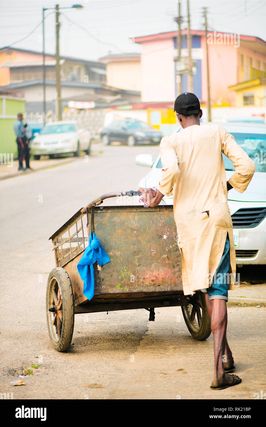Urban jobs - A scavenger in the streets of Lagos with his cart Stock ...