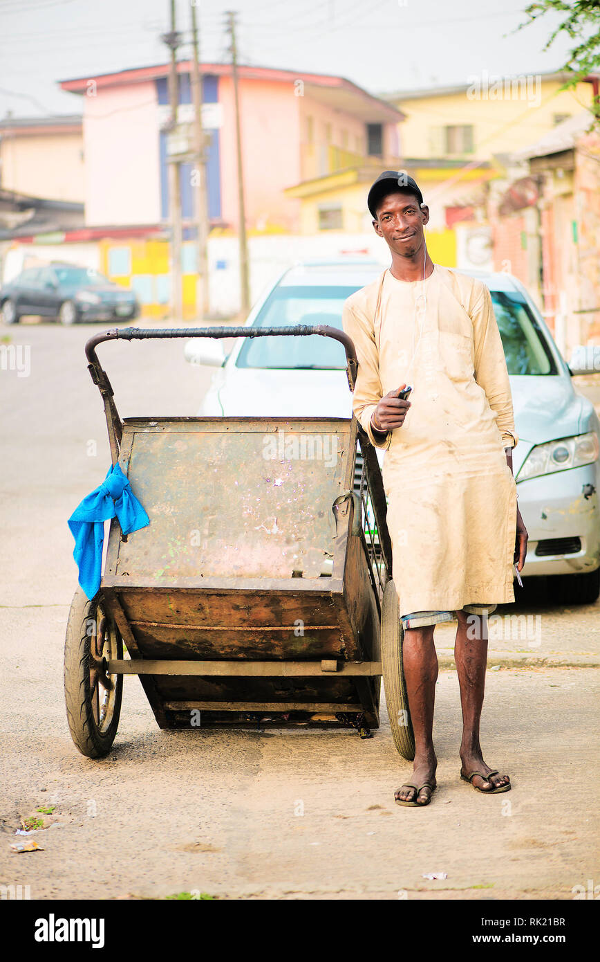 Urban jobs - A scavenger in the streets of Lagos with his cart Stock ...