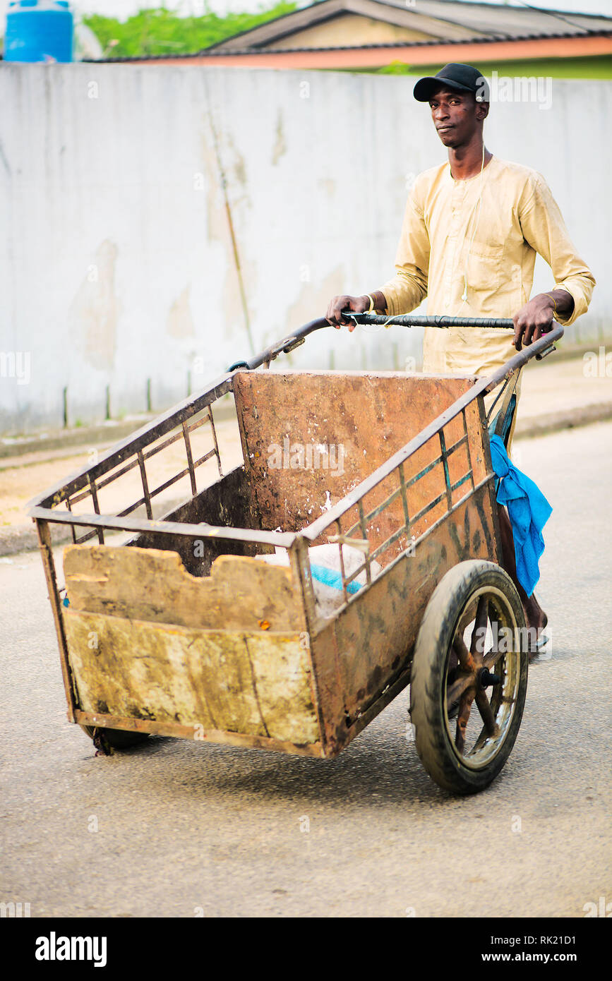Urban jobs - A scavenger in the streets of Lagos with his cart Stock ...