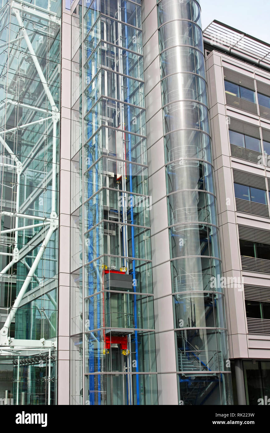 Glass liftshaft with transparent lift in skyscraper Stock Photo - Alamy
