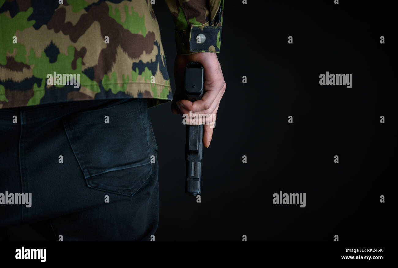 soldier holds gun in the hand Stock Photo - Alamy