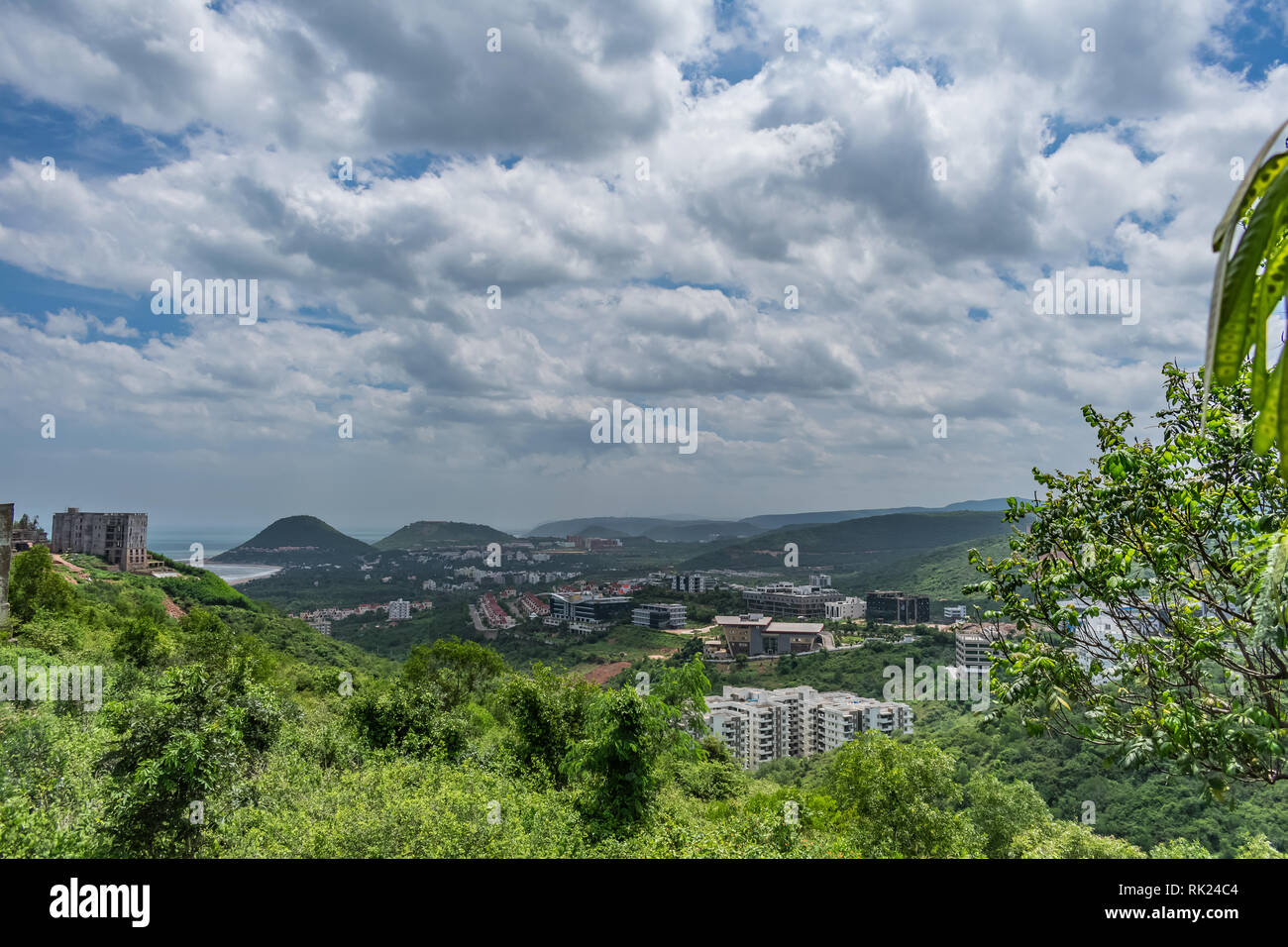Awesome view of city building from top of a mountain with white sky ...