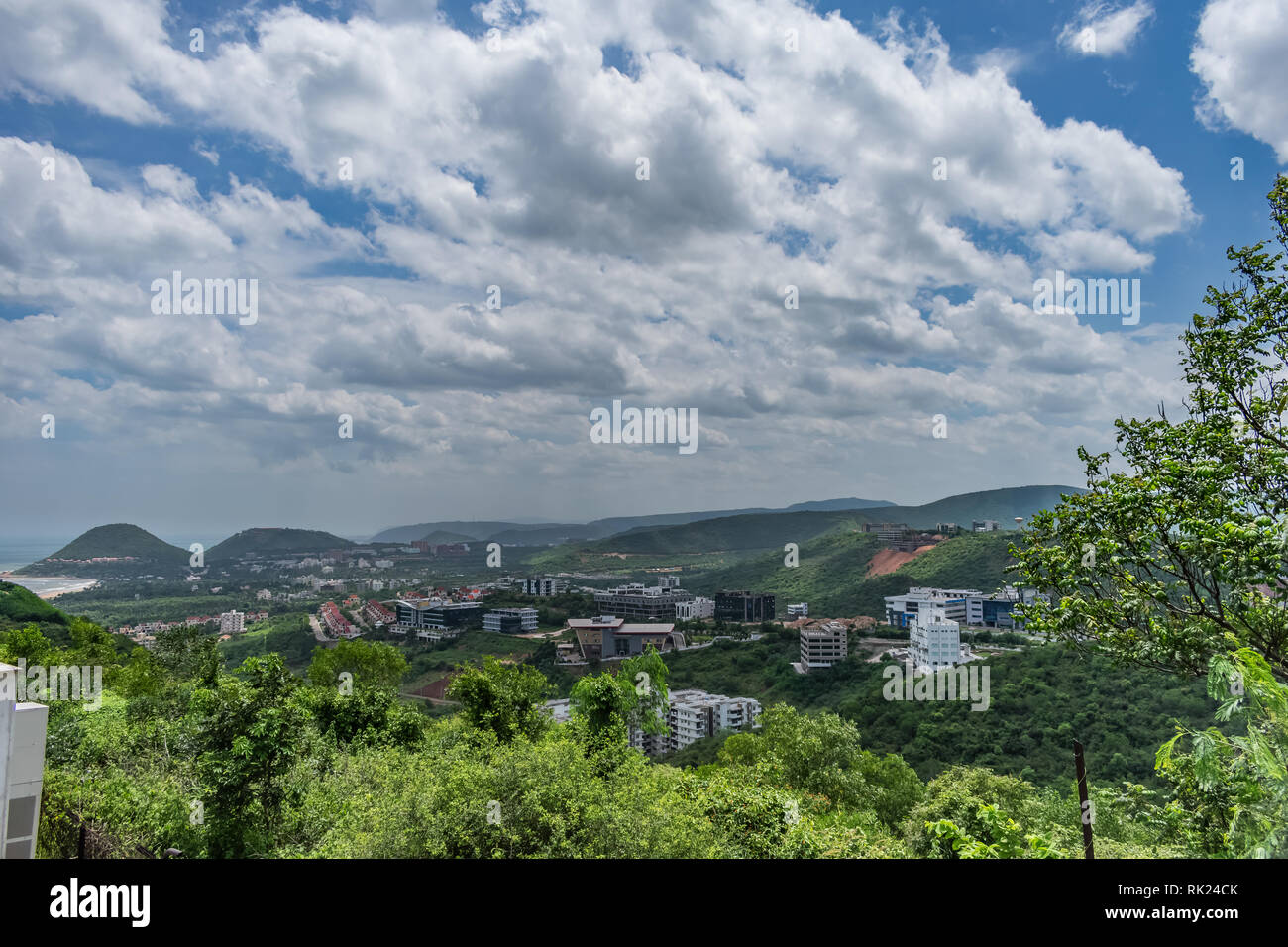Awesome view of city building from top of a mountain with white sky ...