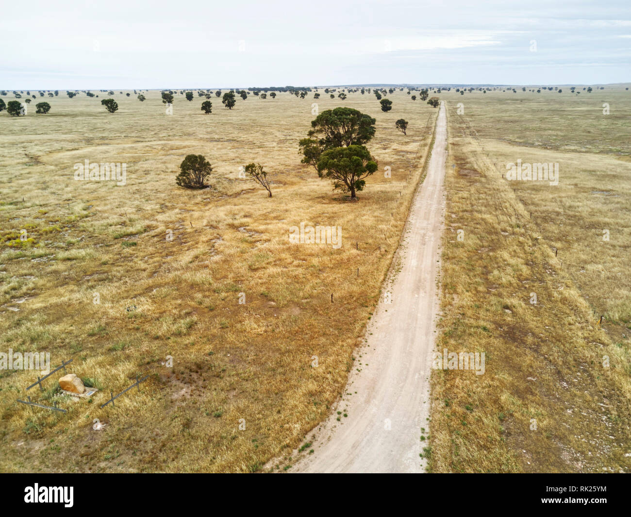 Dirt road leading through surrounded by rocky barren ground that was ...