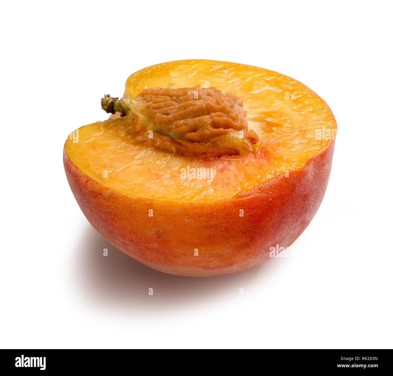 Ripe half peach isolated on white background Stock Photo - Alamy
