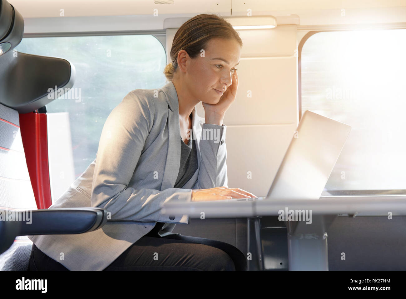 Woman On A Laptop Train High Resolution Stock Photography and Images ...