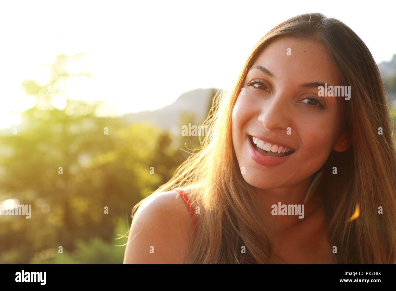 Woman smiling with perfect smile and white teeth thinking and looking ...