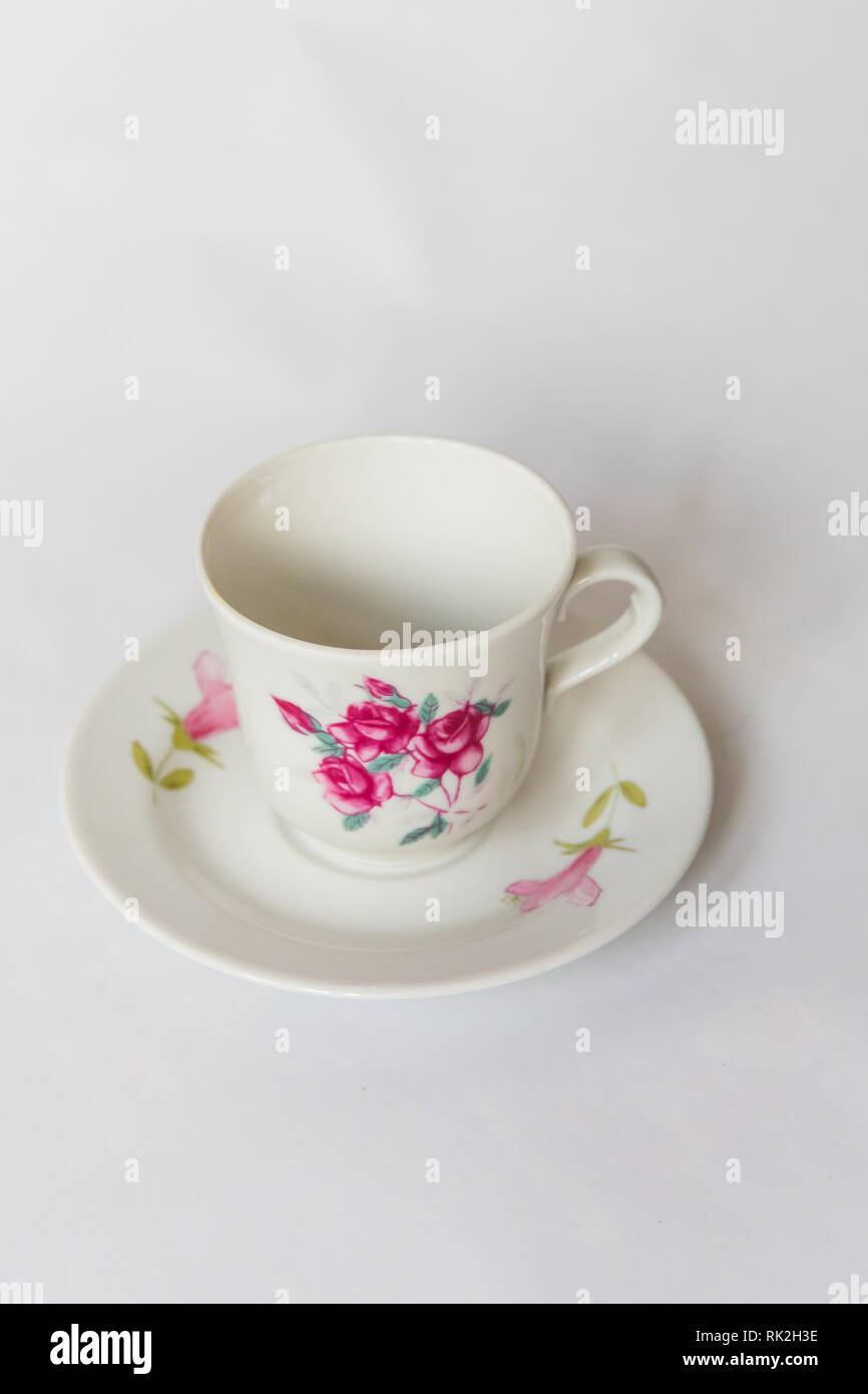 a white tea set with pattern on white background Stock Photo - Alamy