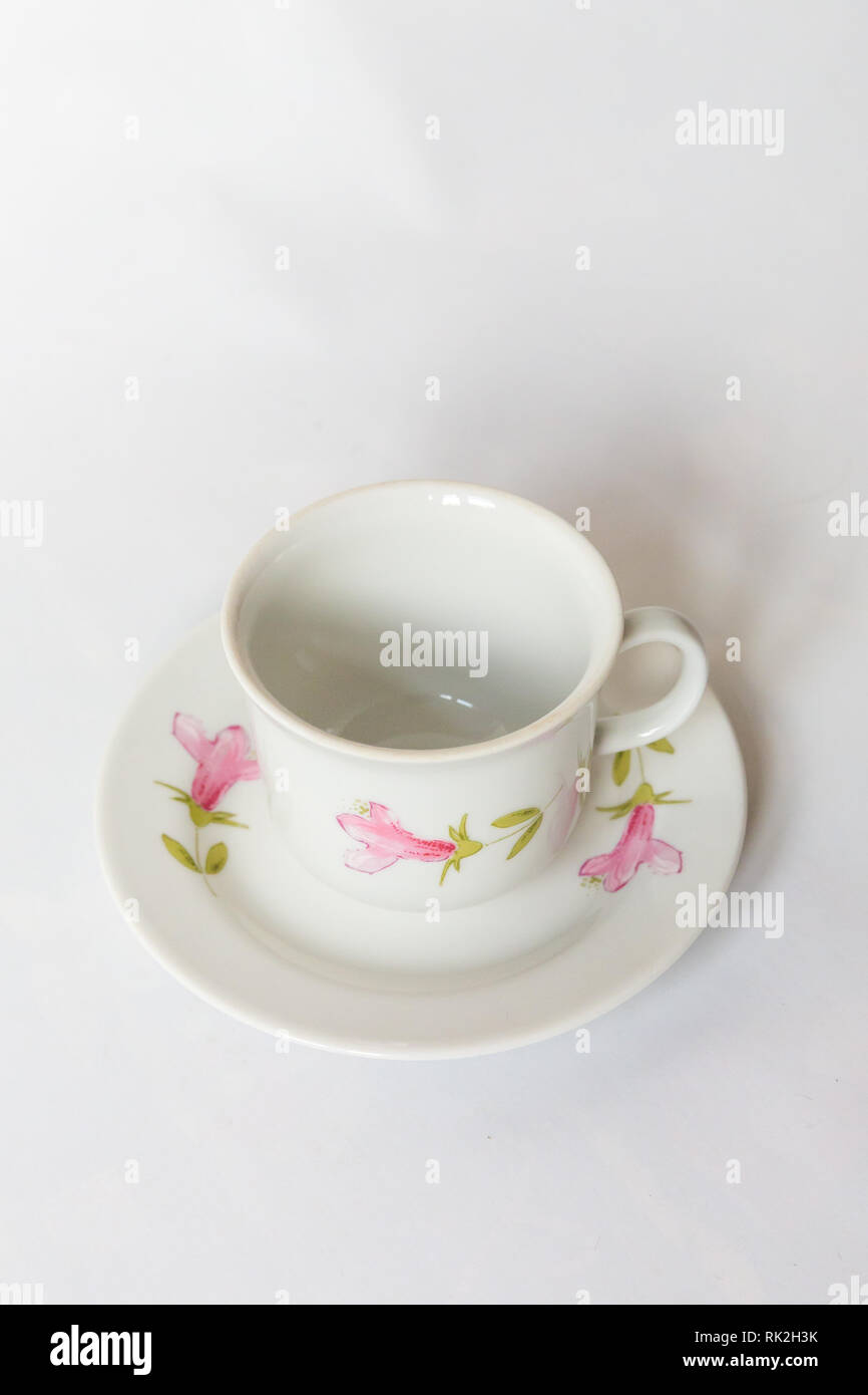 a white tea set with pattern on white background Stock Photo - Alamy