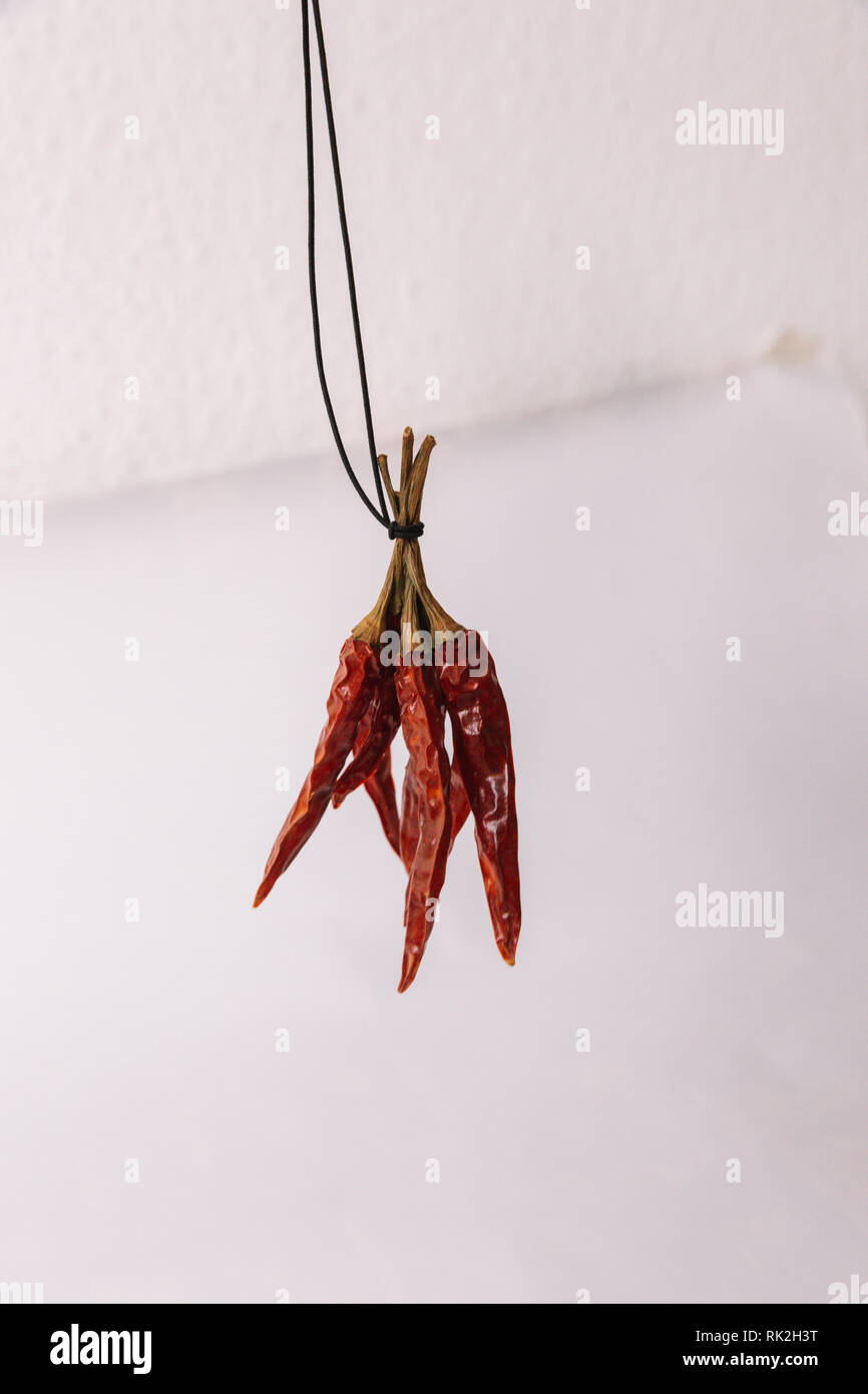 Bunch of dried chilli on white background Stock Photo - Alamy