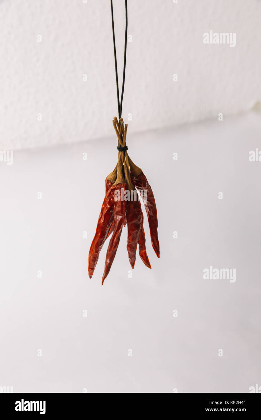 Bunch of dried chilli on white background Stock Photo - Alamy