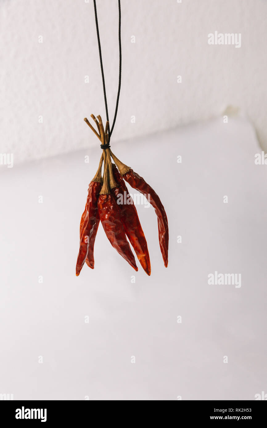 Bunch of dried chilli on white background Stock Photo - Alamy