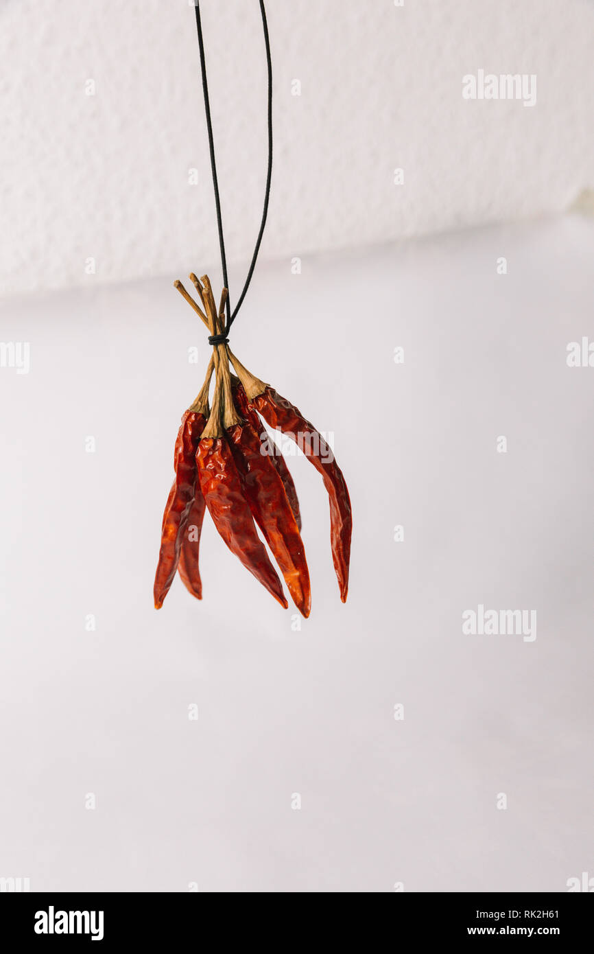 Bunch of dried chilli on white background Stock Photo - Alamy