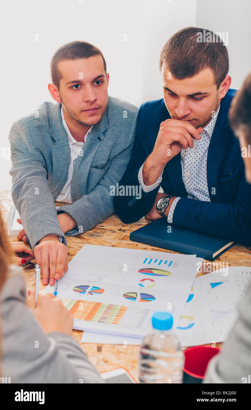 People in business suits are working with diagrams in the office Stock ...