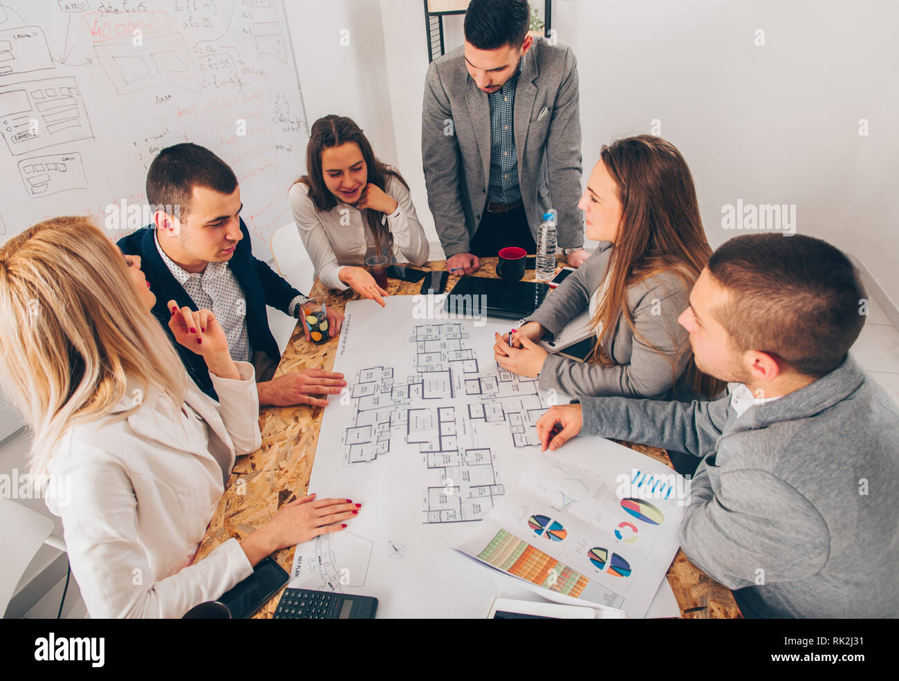 Group of people are having a collaboration about the diagrams and ...