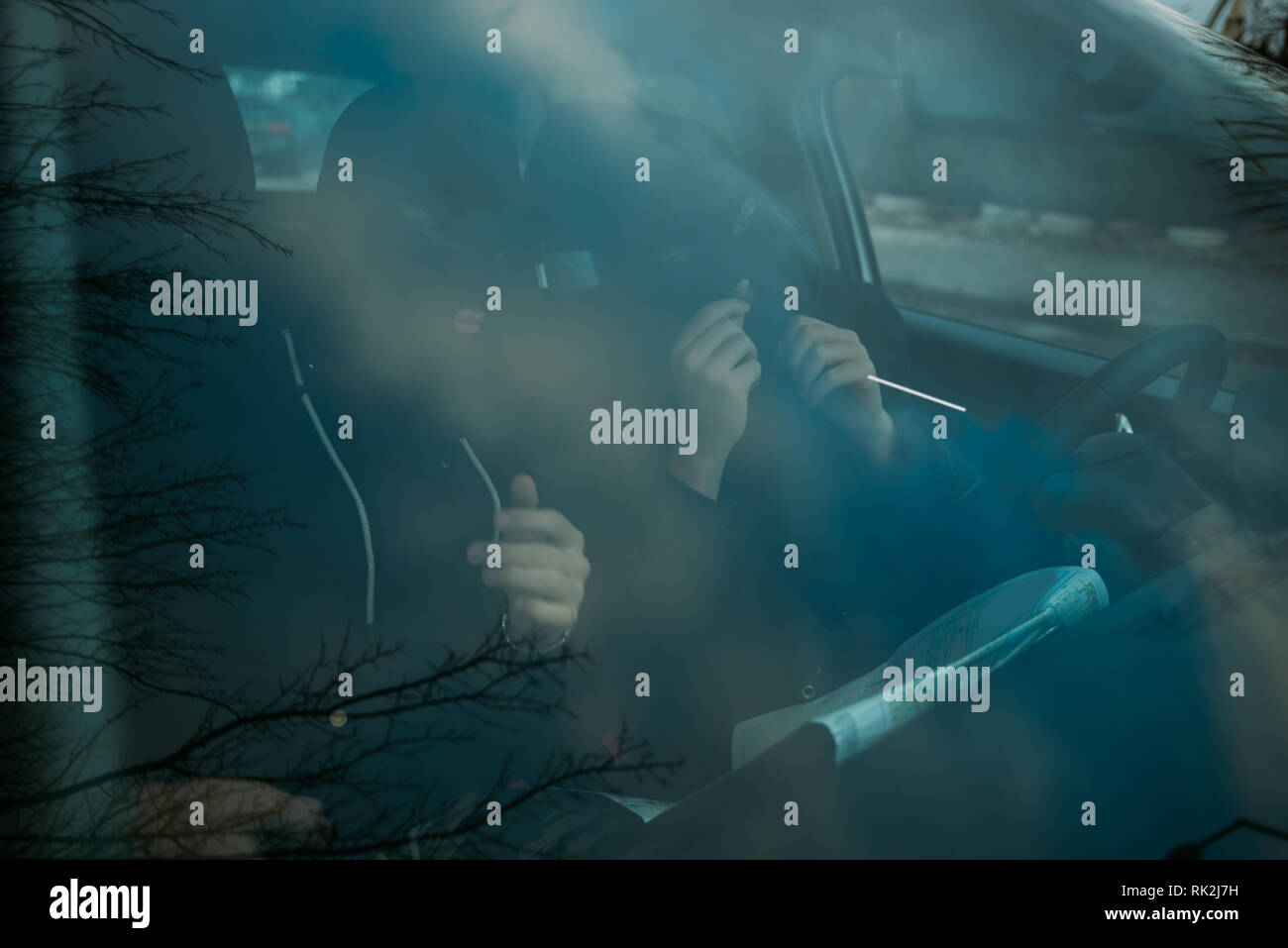 bank robbers putting their mask on prepared to do their next robbery ...