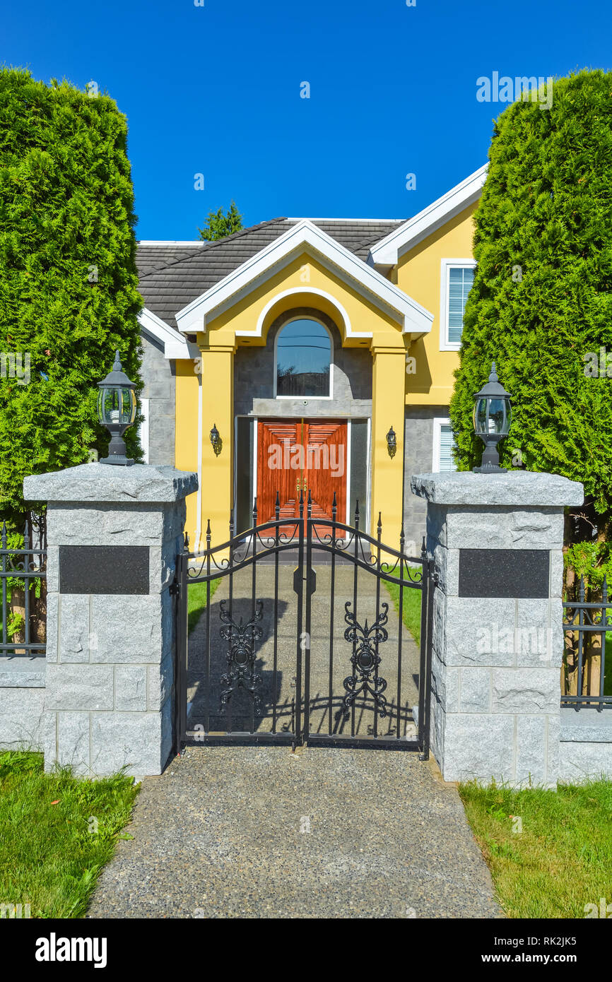 Entrance of luxury family house with cast iron gates in front Stock ...