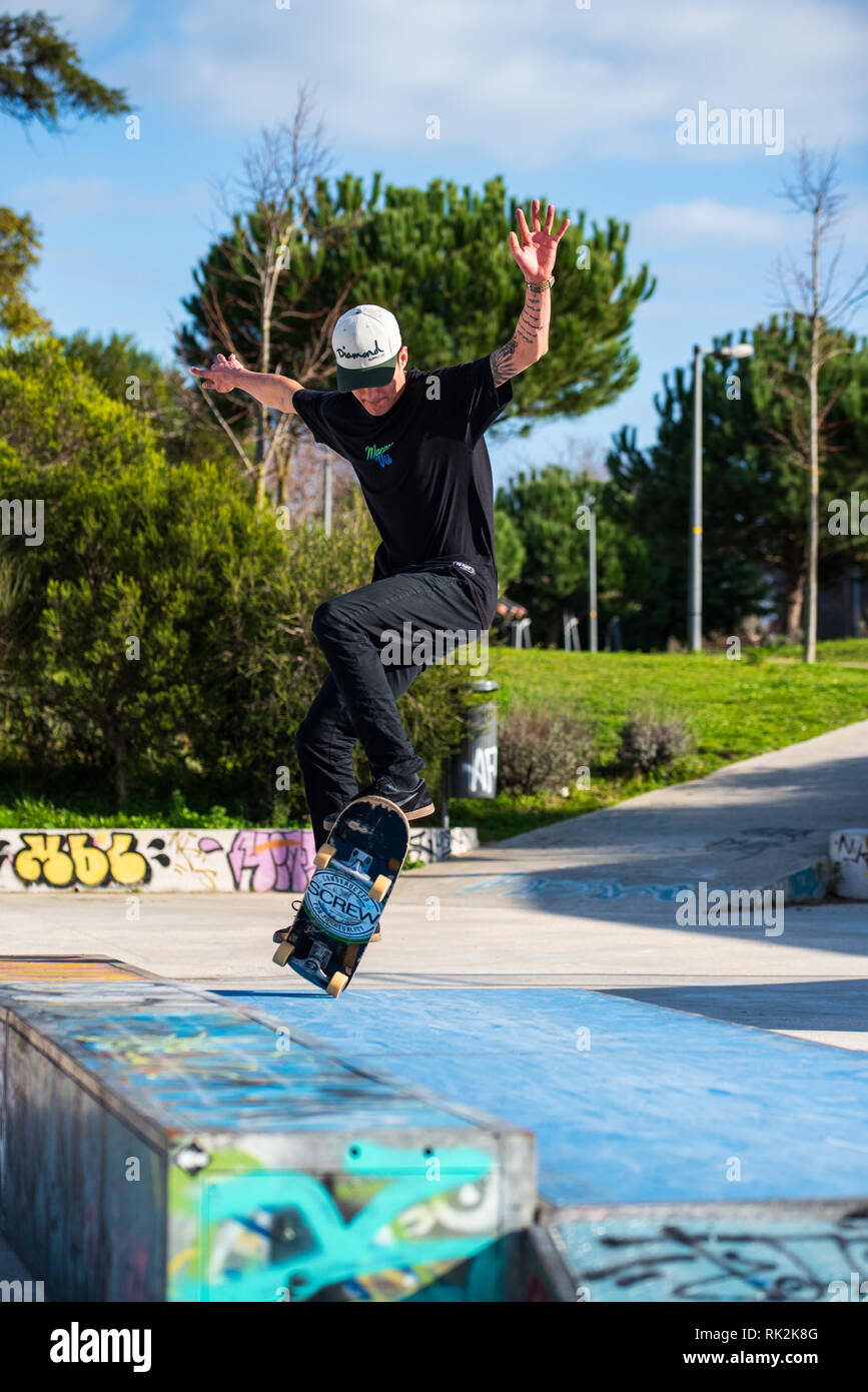 a Skater riding the skate in a half pipe in a skate park in lisbon ...