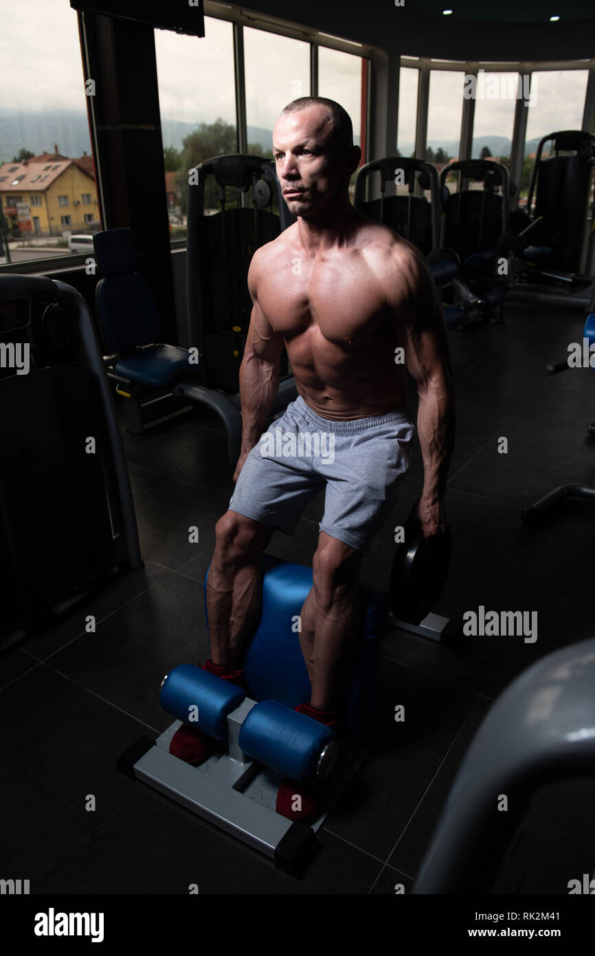 Leg Exercises - Man Doing Legs Without Weights Squats Stock Photo - Alamy