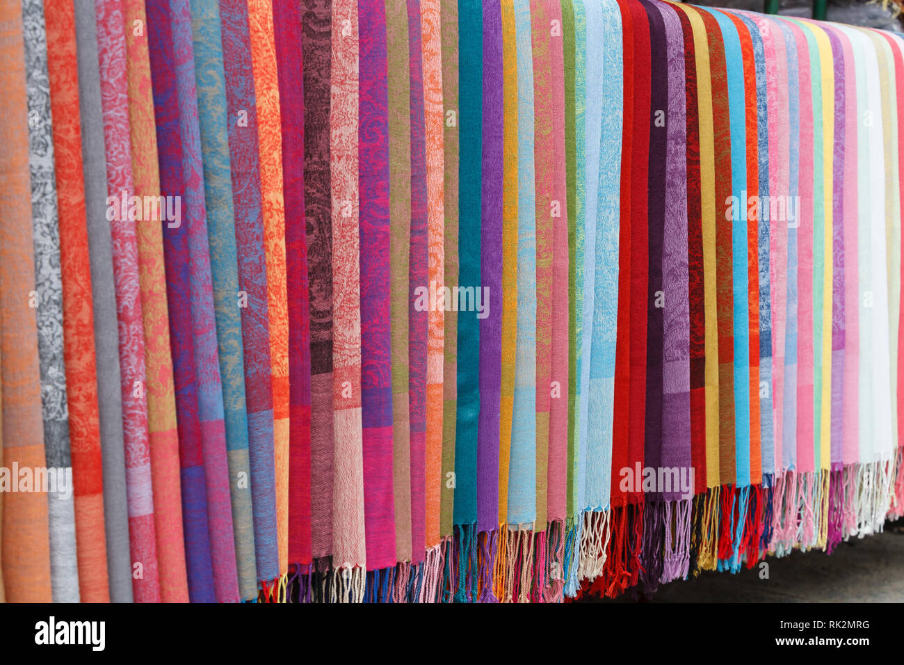 Colorful silk scarves on display in street market Stock Photo - Alamy