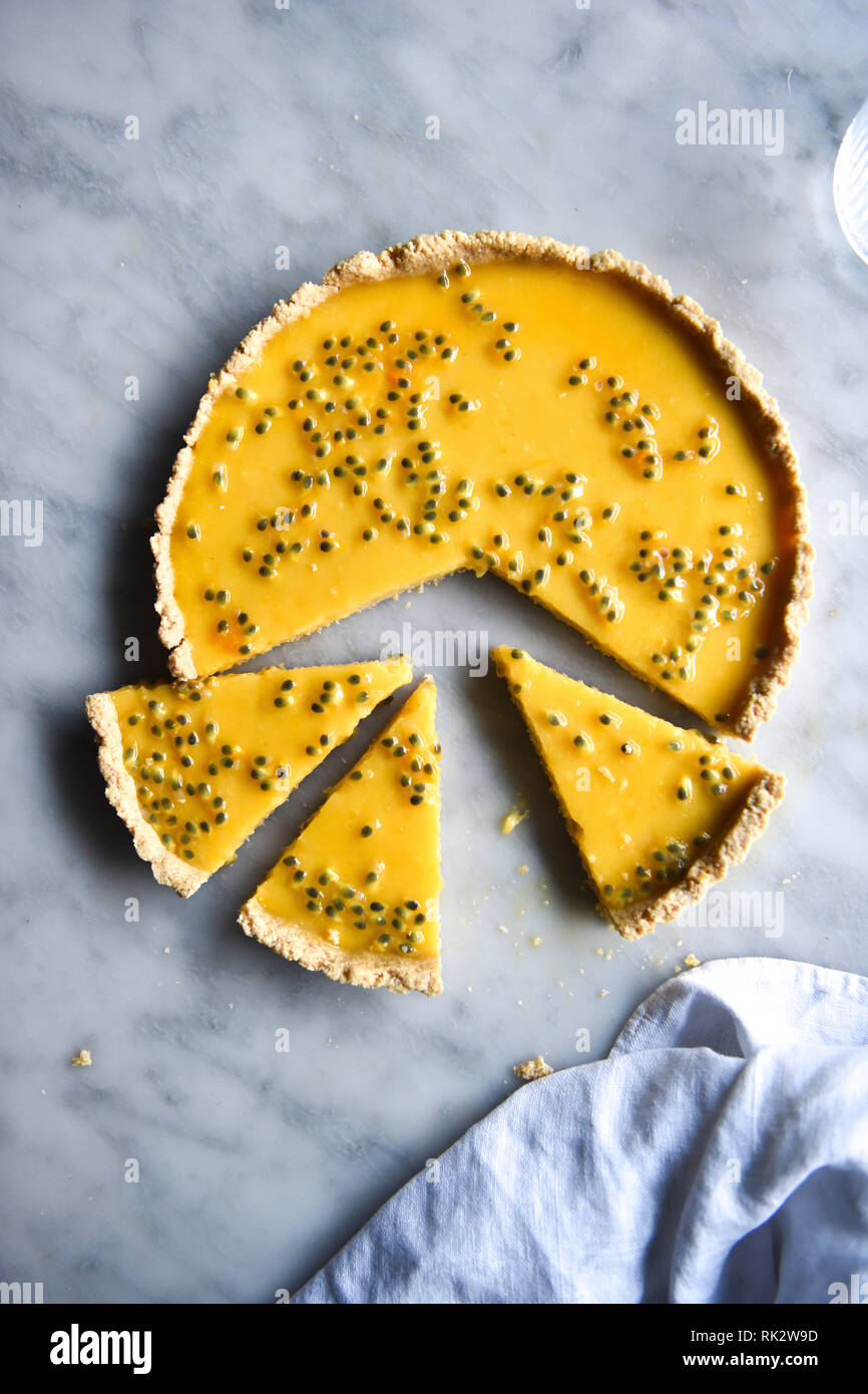 Lemon curd tart with passion fruit Stock Photo - Alamy