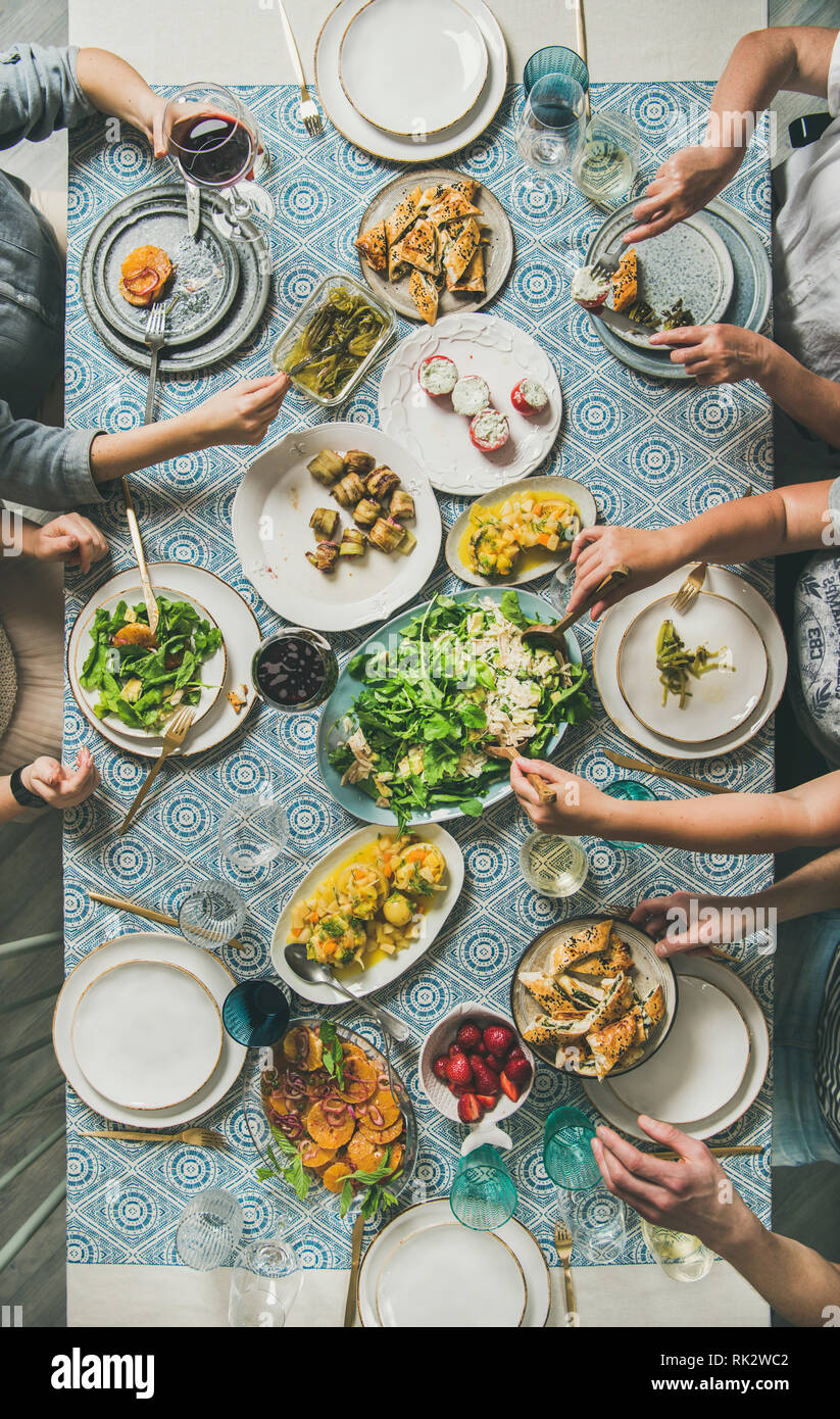Mediterranean style dinner. Flat-lay of table with salad, starters ...