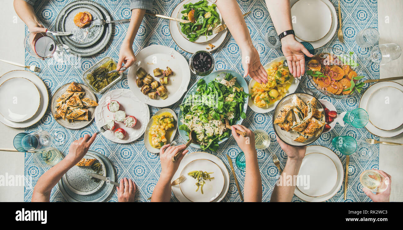 Mediterranean style family or friends dinner. Flat-lay of table with ...