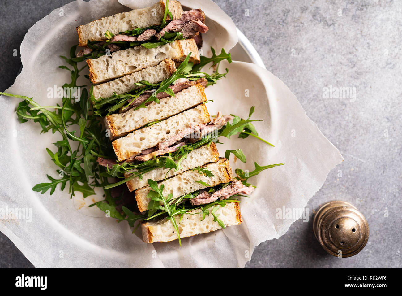 Overhead image of roast beef sandwich with rugula and mustard Stock ...