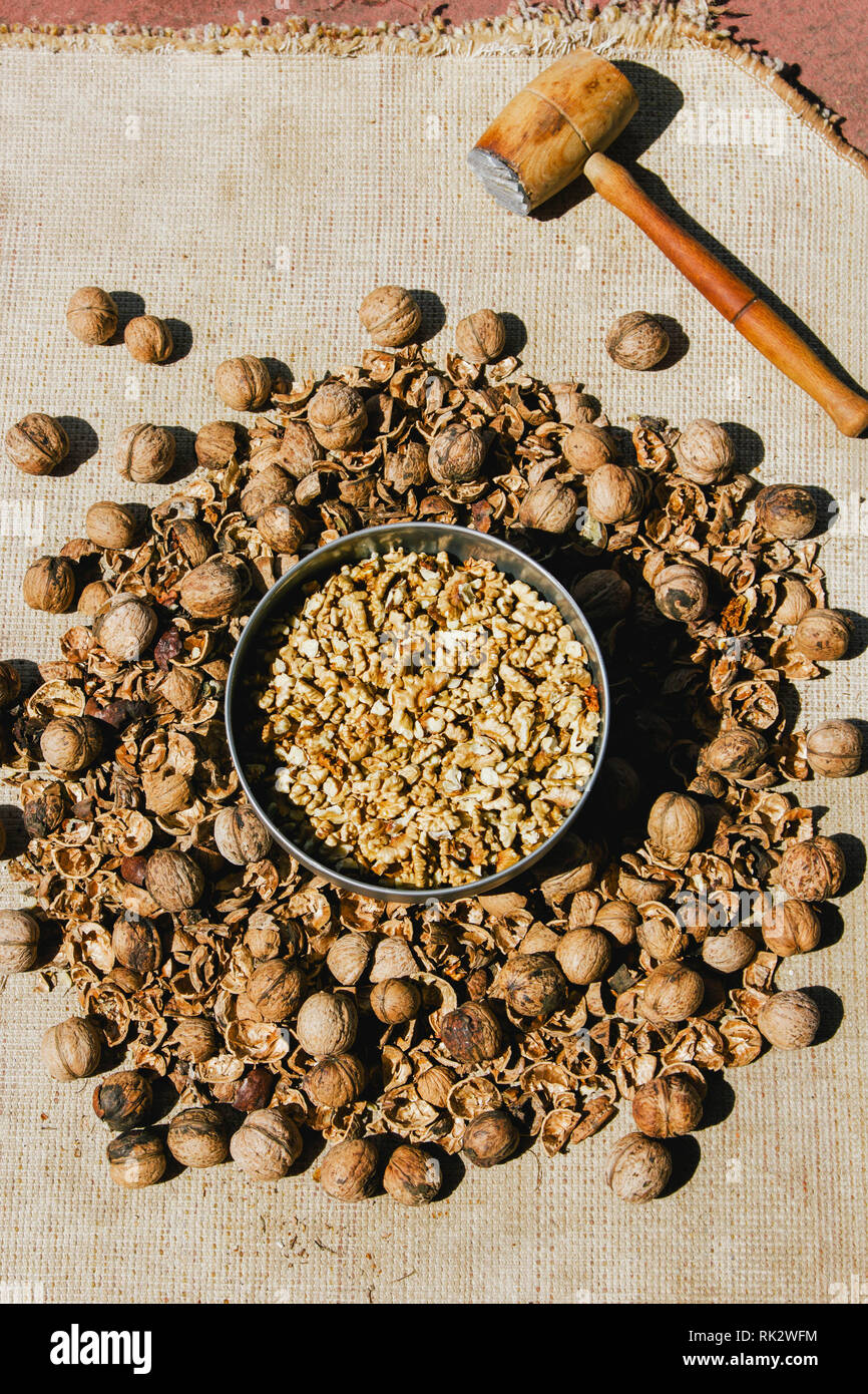 Cracked nuts with a hammer Stock Photo - Alamy