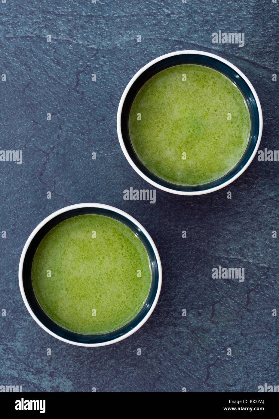 Matcha green tea in two small Japanese cups Stock Photo - Alamy