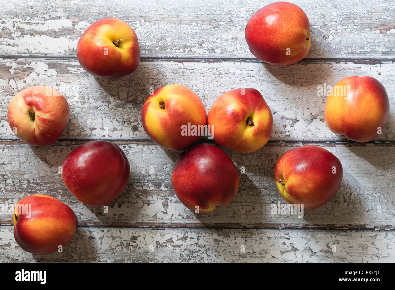 Red and yellow nectarines on wooden boards Stock Photo - Alamy
