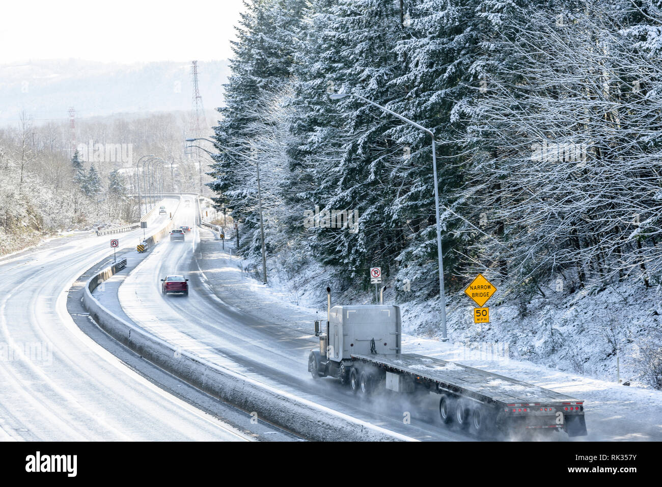 Big rig long haul semi truck tractor transporting empty semi trailer ...