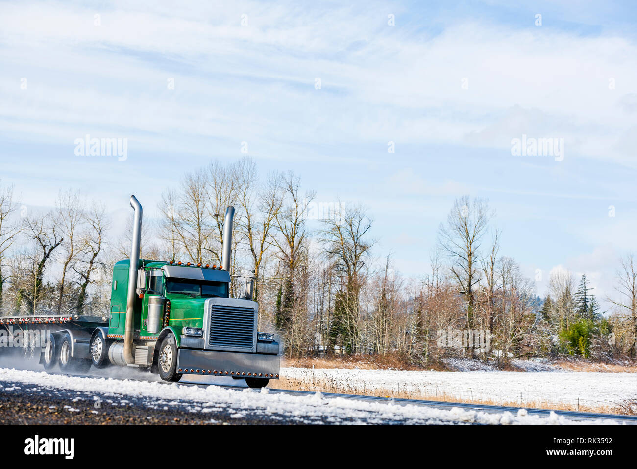 Big rig long haul semi truck tractor transporting empty semi trailer ...