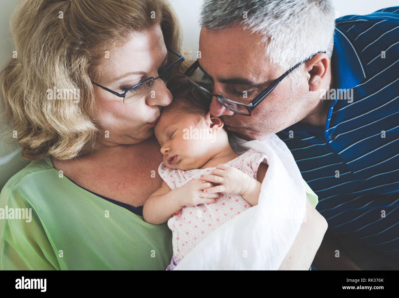 Grandparents Holding Sleeping Newborn Baby Granddaughter Stock Photo ...