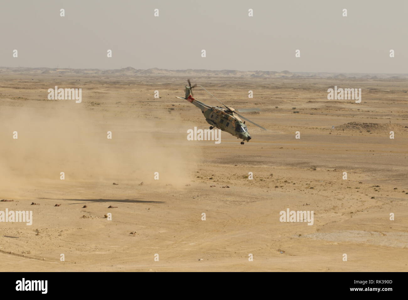 A Royal Air Force of Oman NH-90 helicopter takes off after a quick stop ...