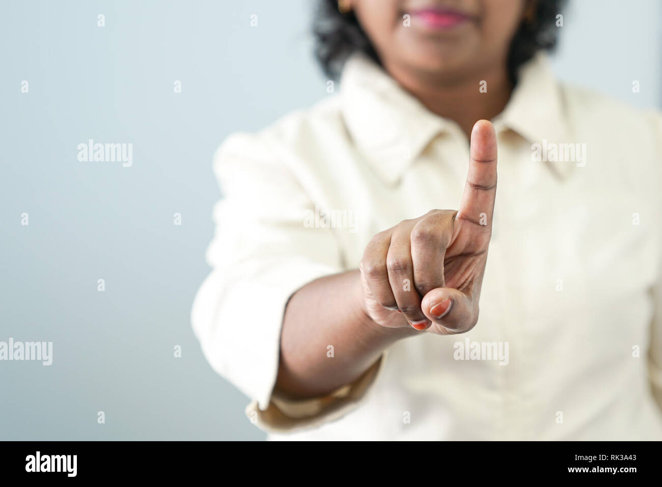 Closeup of index finger pointing up or touching front Stock Photo - Alamy