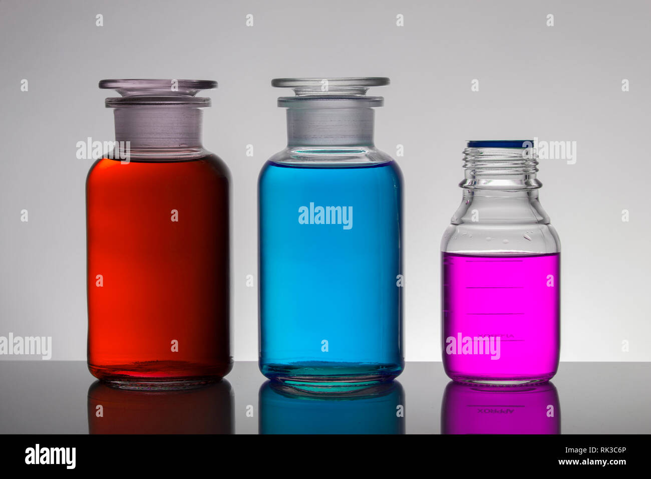 Liquid in laboratory bottles. Scientific biochemical laboratory ...