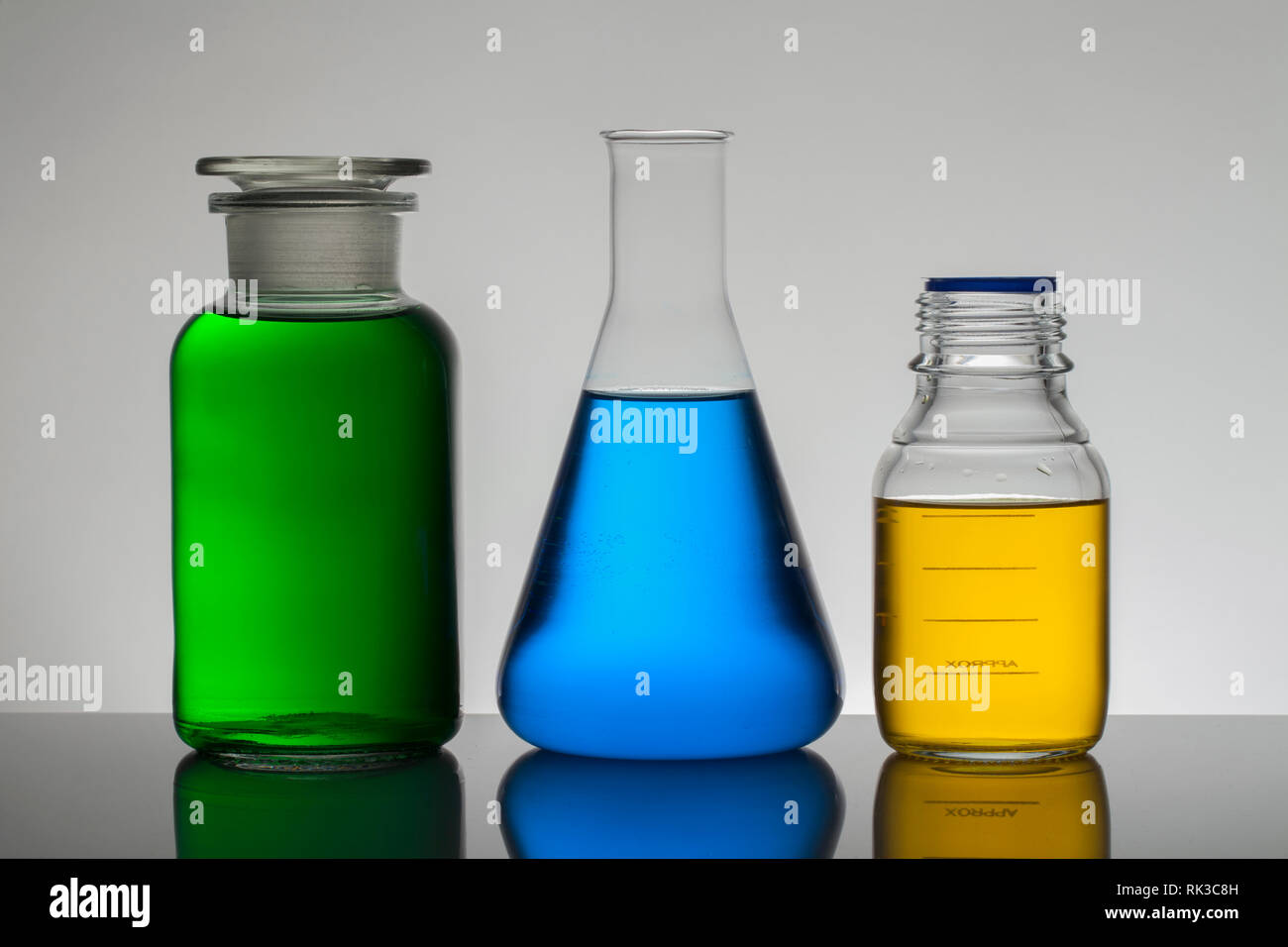 Liquid in laboratory bottles. Scientific biochemical laboratory ...