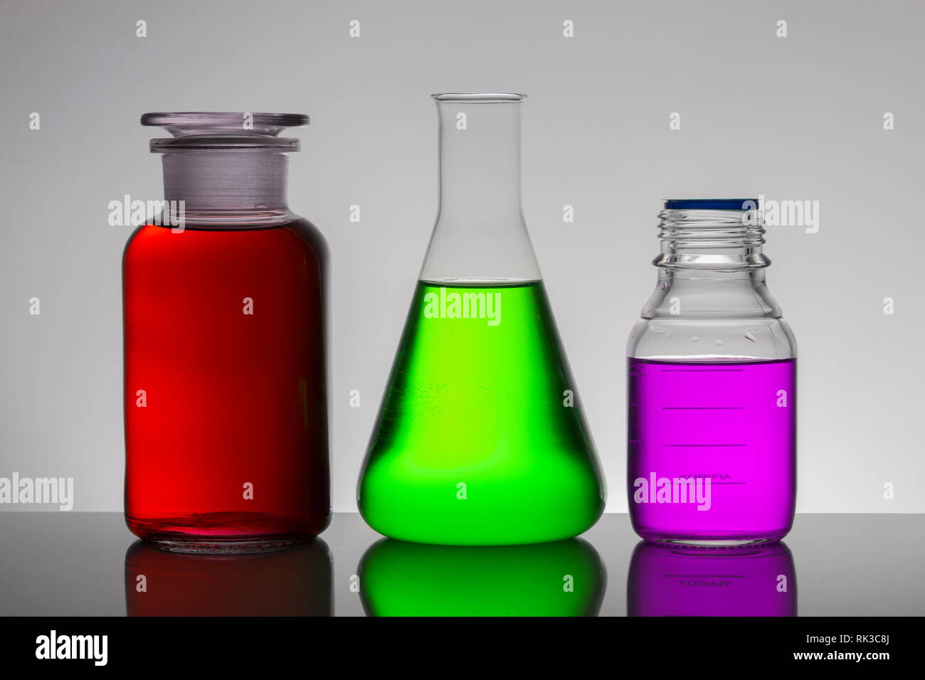 Liquid in laboratory bottles. Scientific biochemical laboratory ...