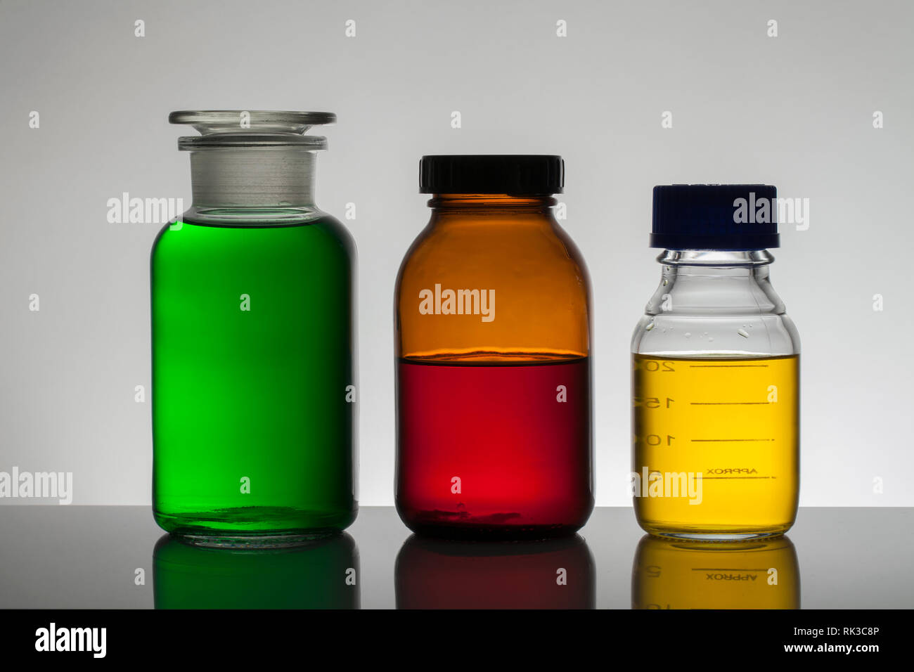 Liquid in laboratory bottles. Scientific biochemical laboratory ...