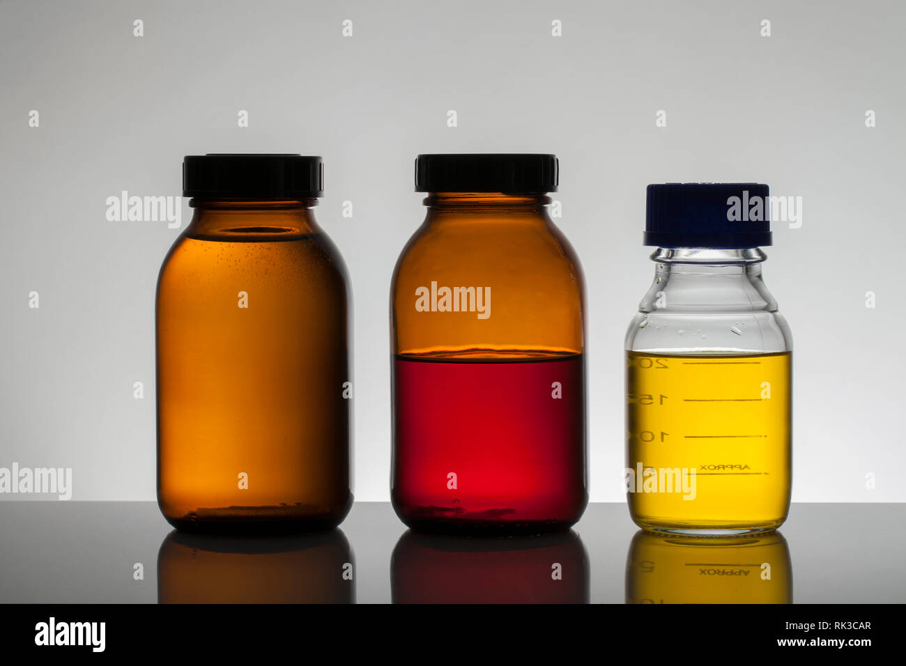 Liquid in laboratory bottles. Scientific biochemical laboratory ...