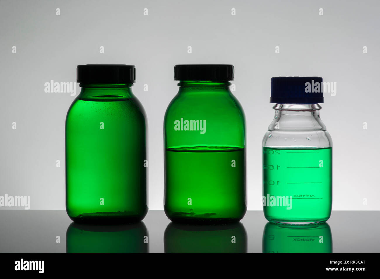 Liquid in laboratory bottles. Scientific biochemical laboratory ...