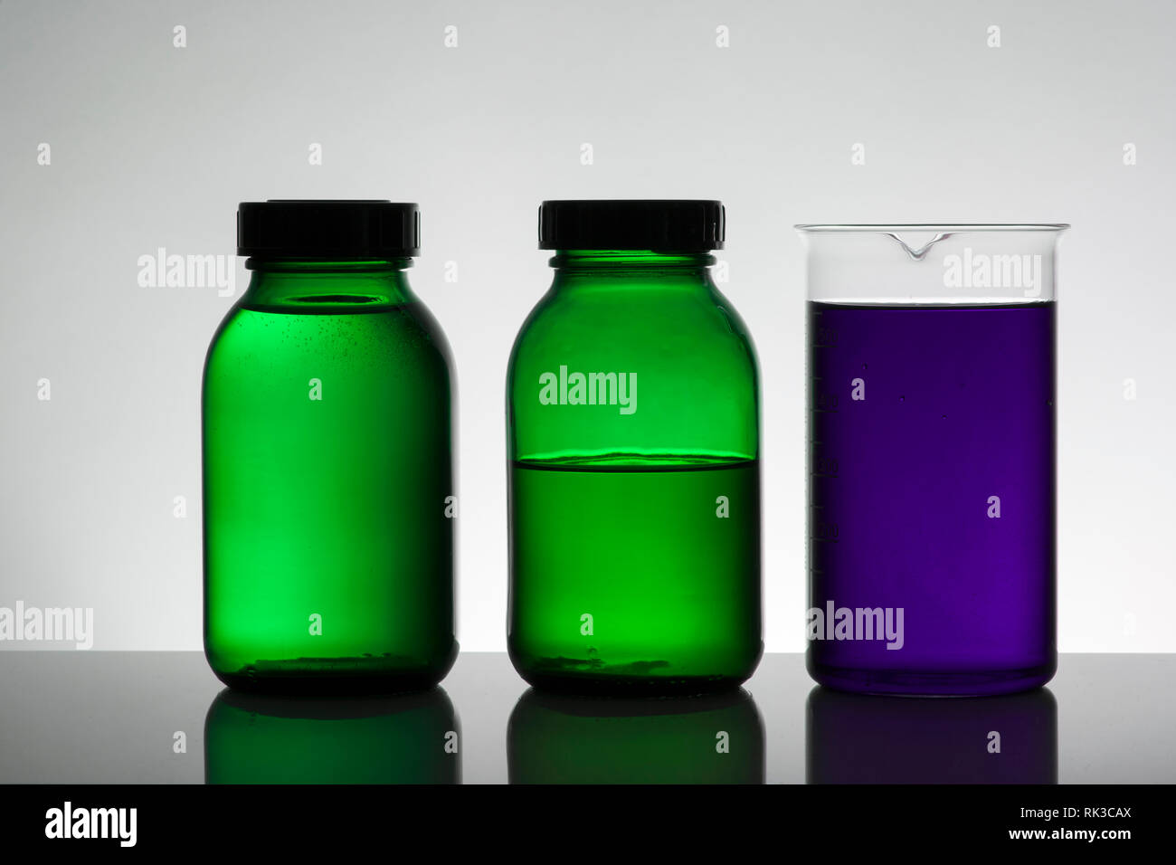 Liquid in laboratory bottles. Scientific biochemical laboratory ...