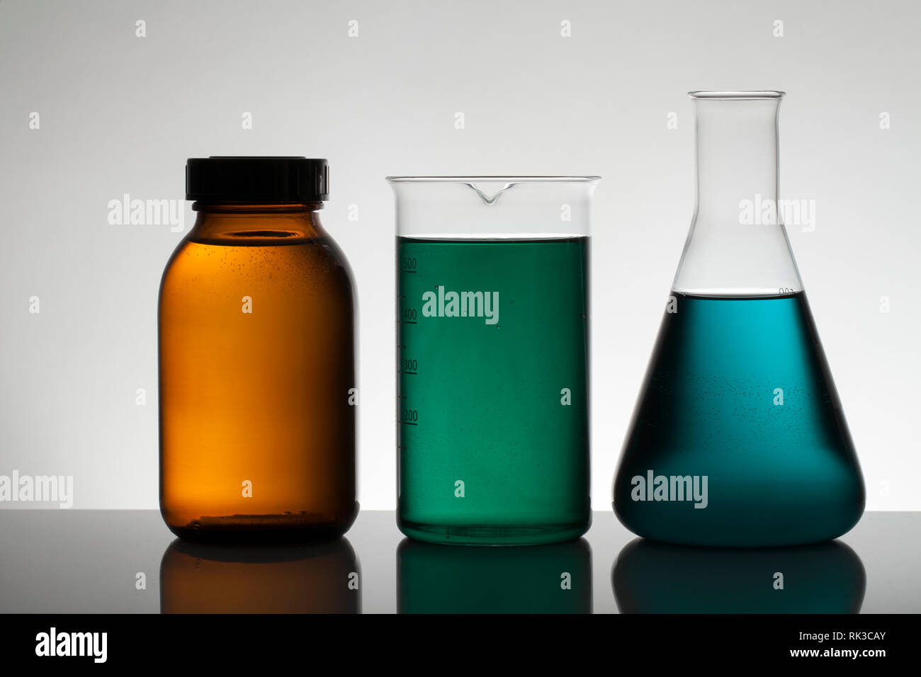 Liquid in laboratory bottles. Scientific biochemical laboratory ...